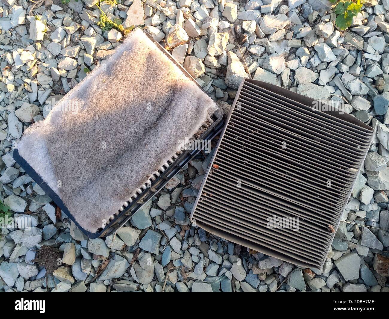 An old dirty filter out of the car. Replacing the air filter Stock ...