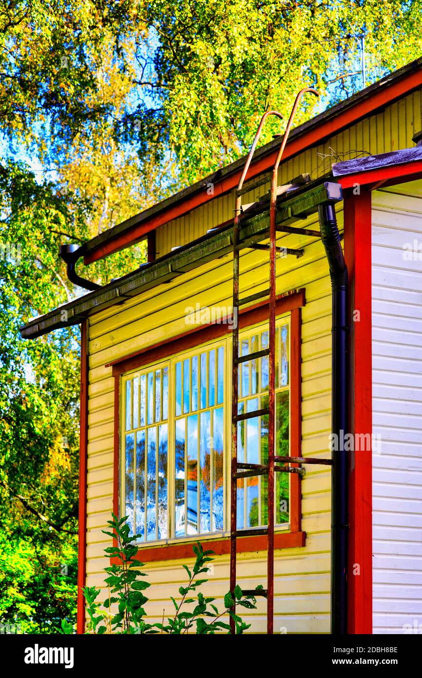Old rustic wooden building with metallic ladder up to roof Stock Photo ...