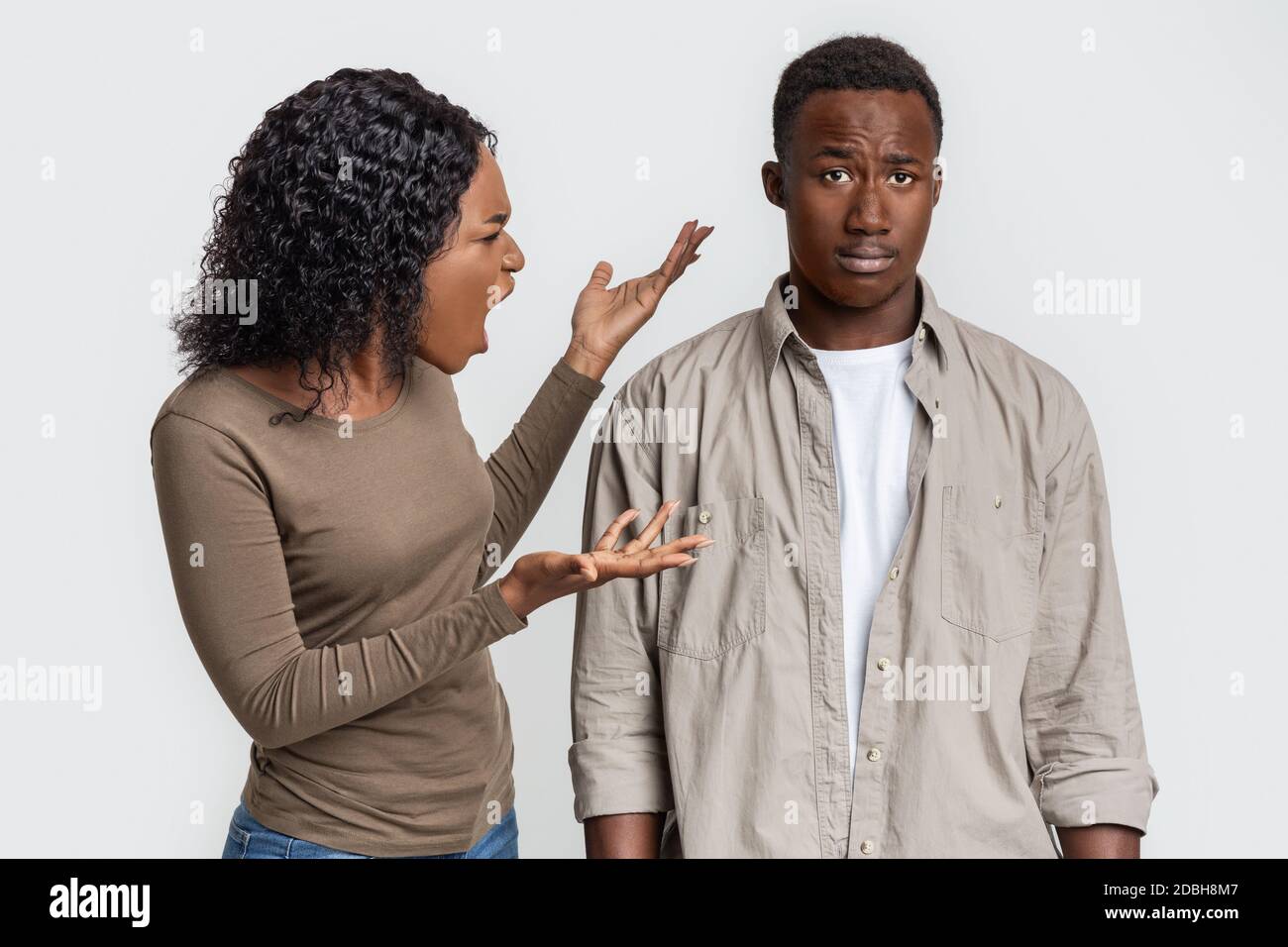 Furious african woman yelling at her boyfriend Stock Photo - Alamy