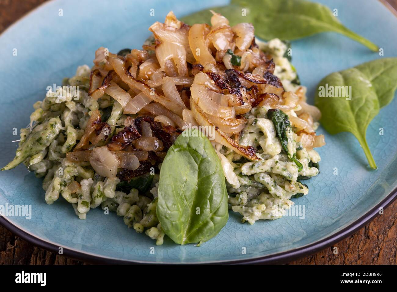 bavarian spinach spaetzle on wood Stock Photo - Alamy