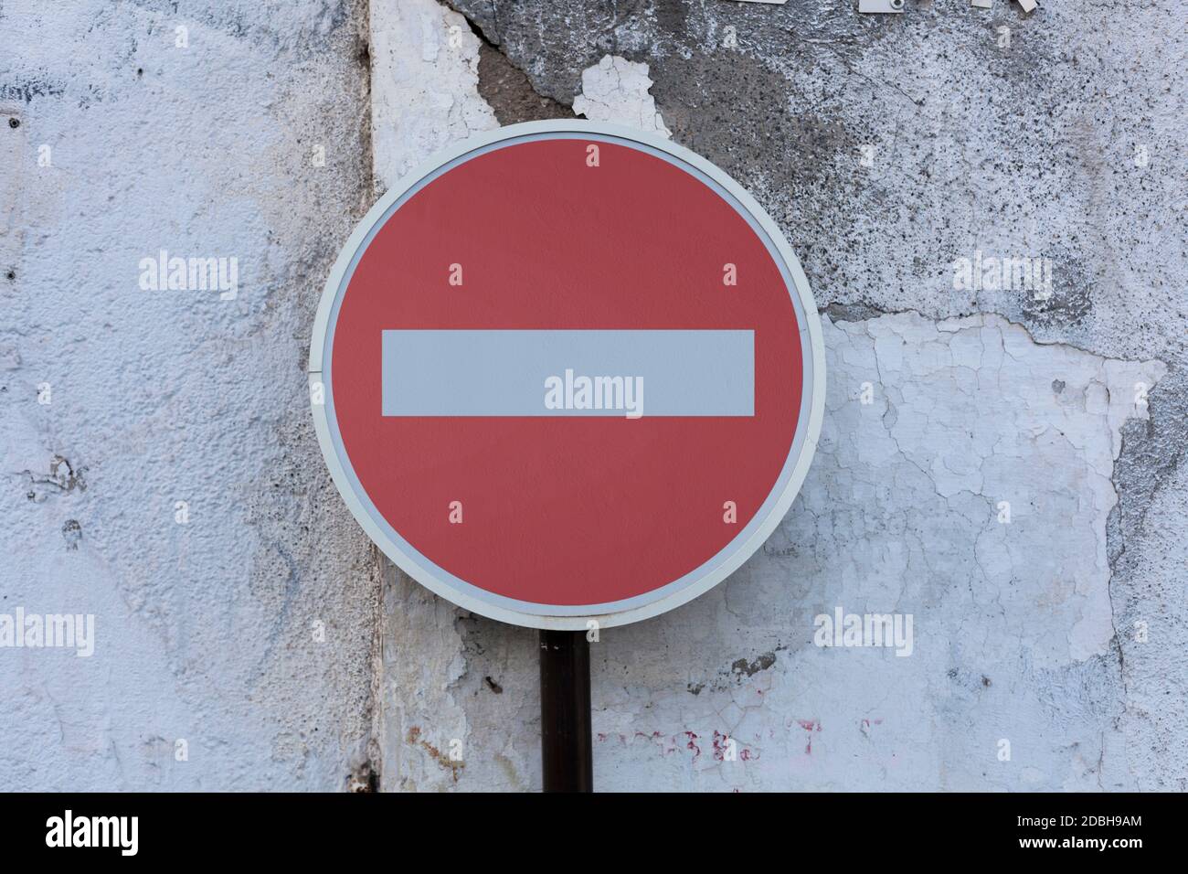 Stop Sign on a stone wall Stock Photo - Alamy