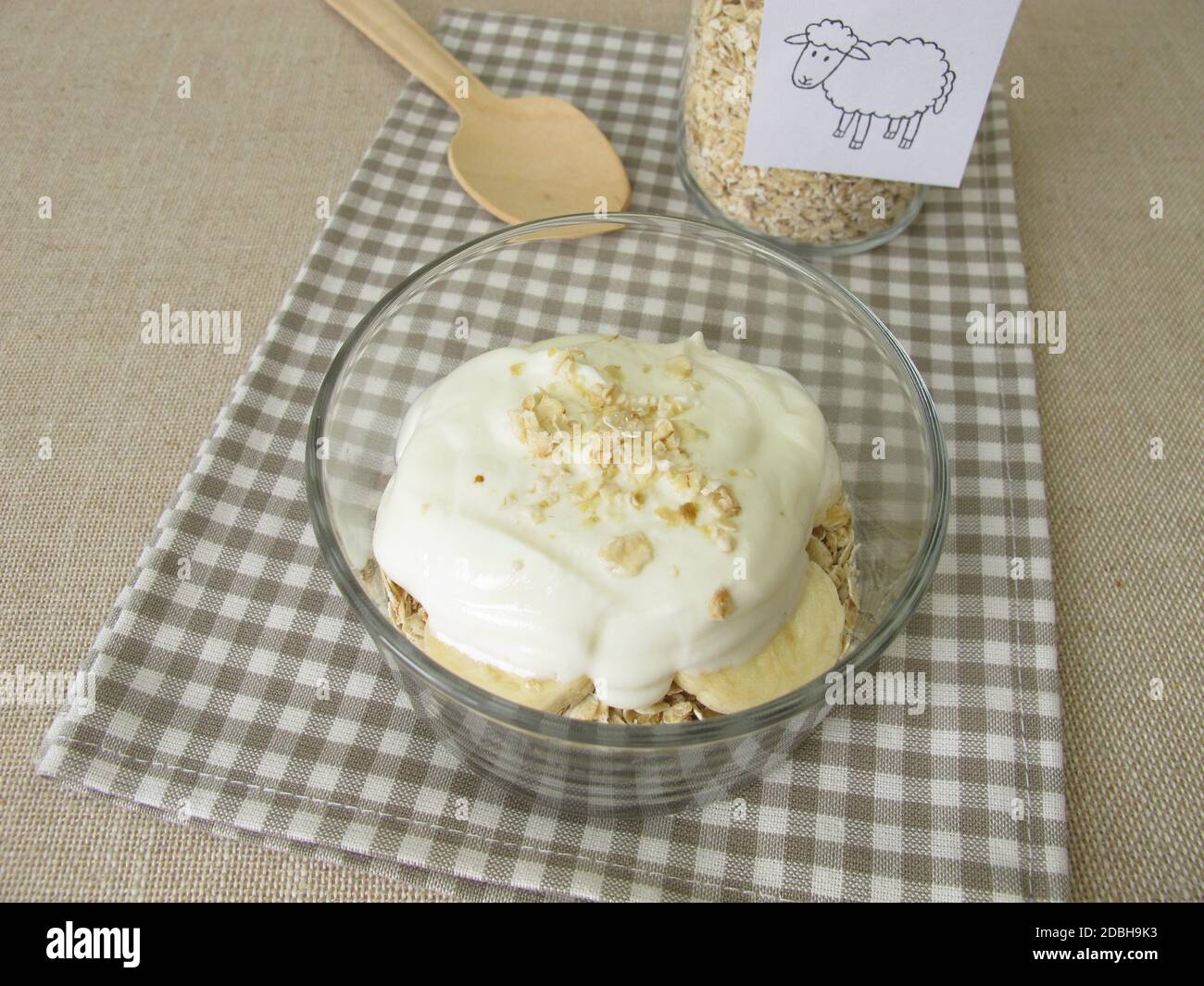 Breakfast with sheep quark, rolled oats and banana Stock Photo - Alamy