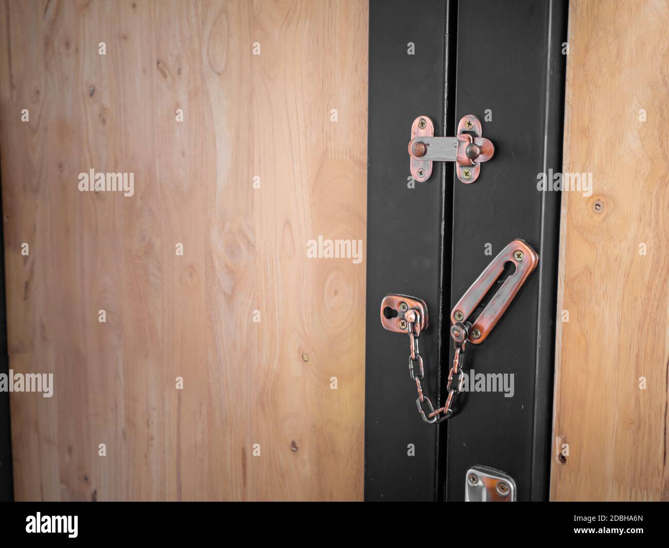 New brown modern wooden door lock in house interior Stock Photo - Alamy
