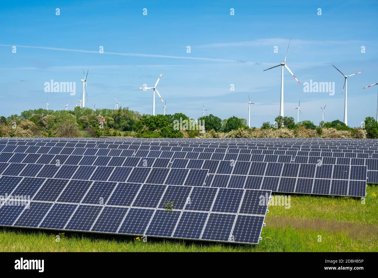 Solar panels with wind wheels in the back seen in Germany Stock Photo ...
