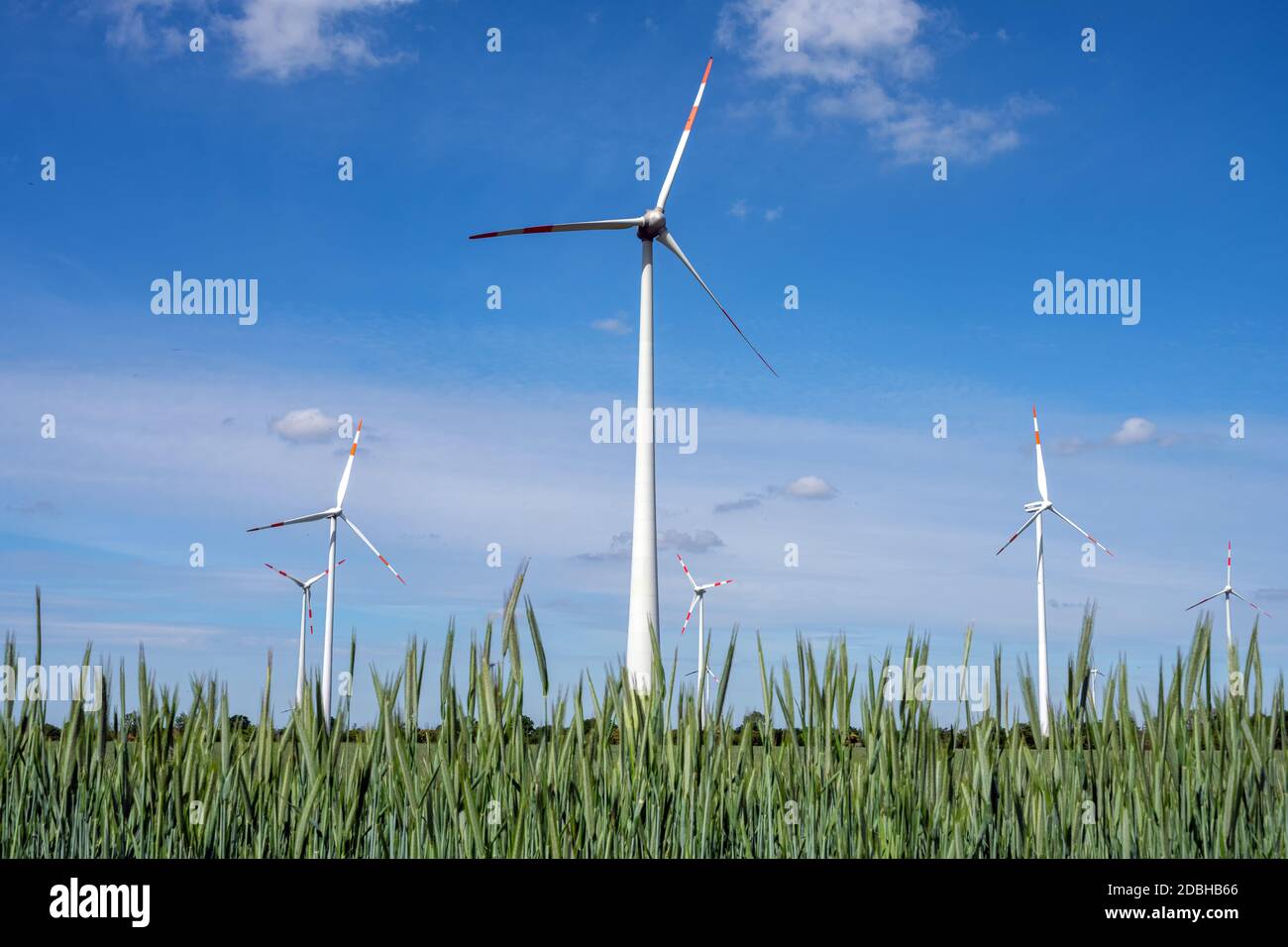 Solar panels with wind wheels in the back seen in Germany Stock Photo ...