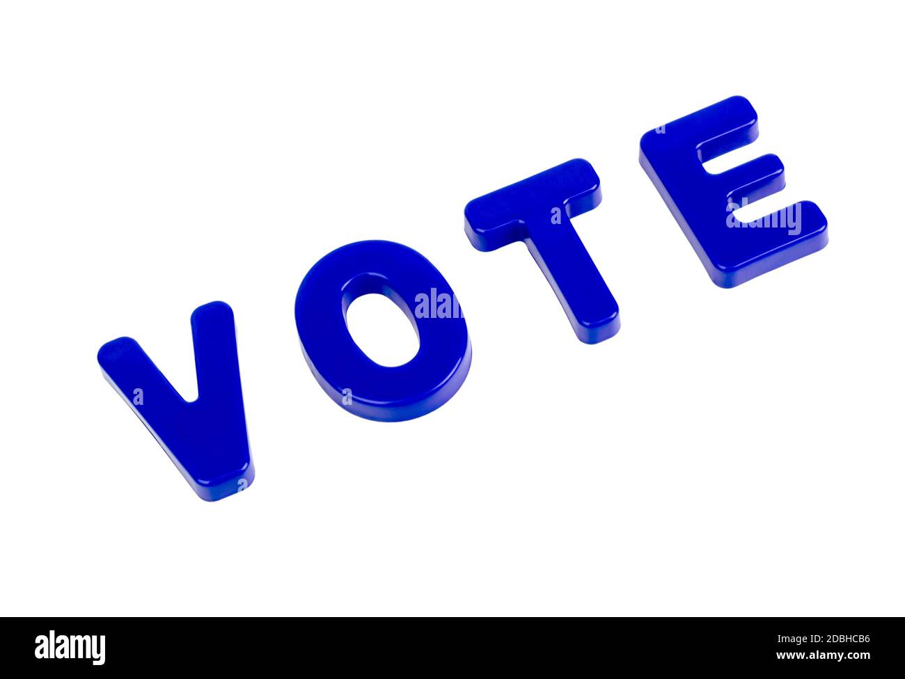 Text VOTE written in plastic letters on a white background. Concept for ...