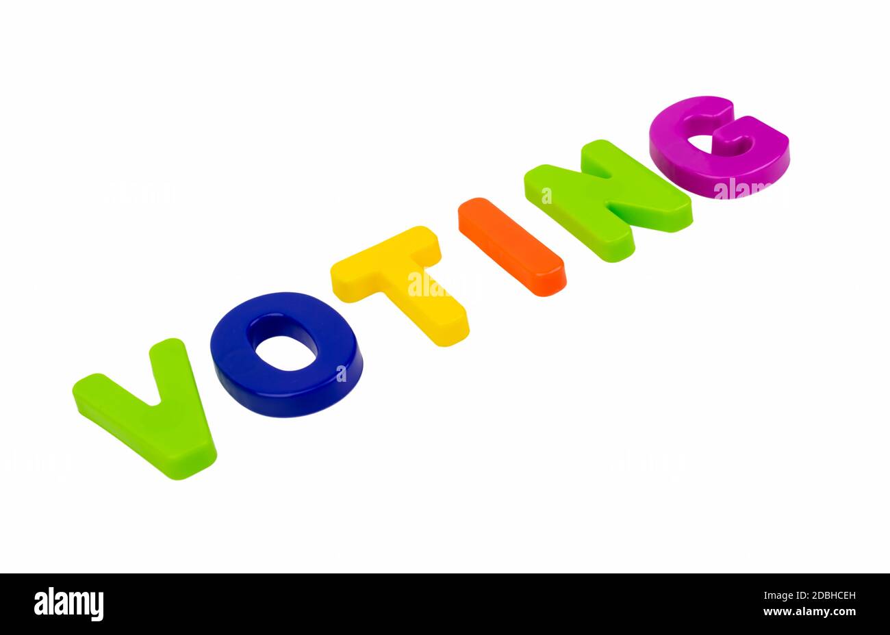 Text VOTING written in plastic letters on a white background. Concept ...