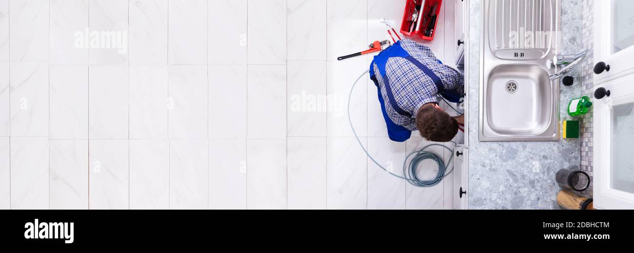 Plumber Cleaning Pipe. Unclog Drain And Sink Stock Photo - Alamy