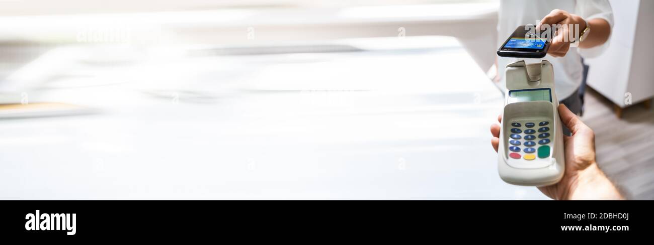 Paying With Mobile Phone To Cashier Using NFC Technology Stock Photo ...