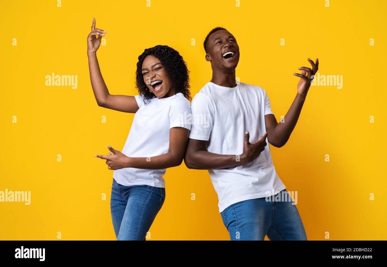 Happy young woman dancing singing hi-res stock photography and images ...