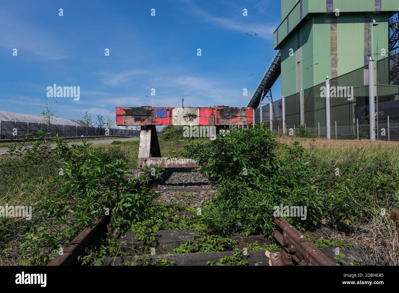 wooden buffer stop with red stop sign ending rail tracks concept for ...