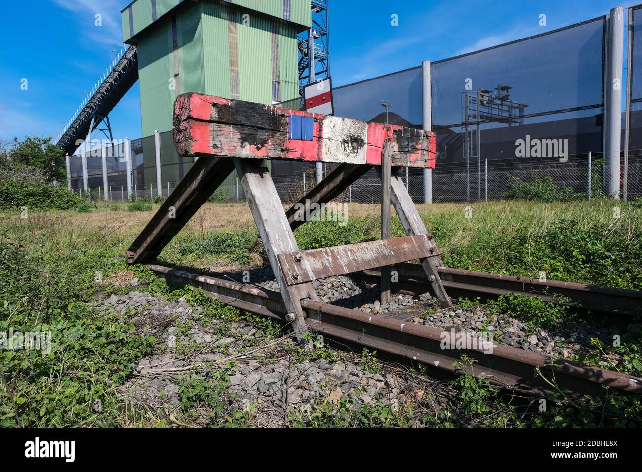 wooden buffer stop with red stop sign ending rail tracks concept for ...