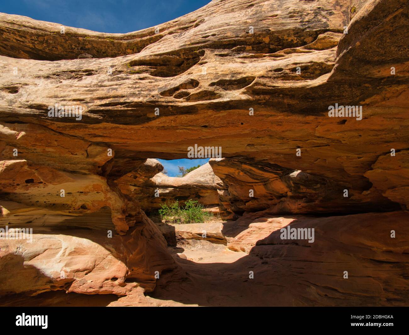 A bizarre rock formation with small tunnel and open cave Stock Photo ...