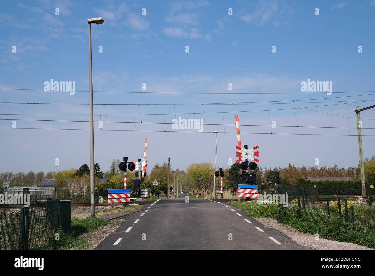 Road signs at the railway crossing with a barrier. Organization of the ...