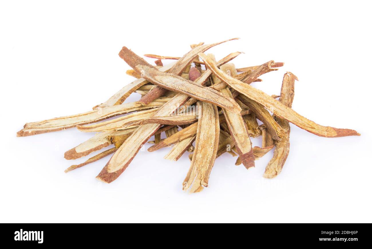 Slice liquorice root on white background Stock Photo - Alamy