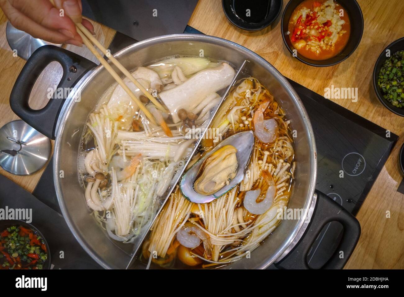 Sukiyaki a Japanese hotpot dish of seafood and vegetables boiled in ...