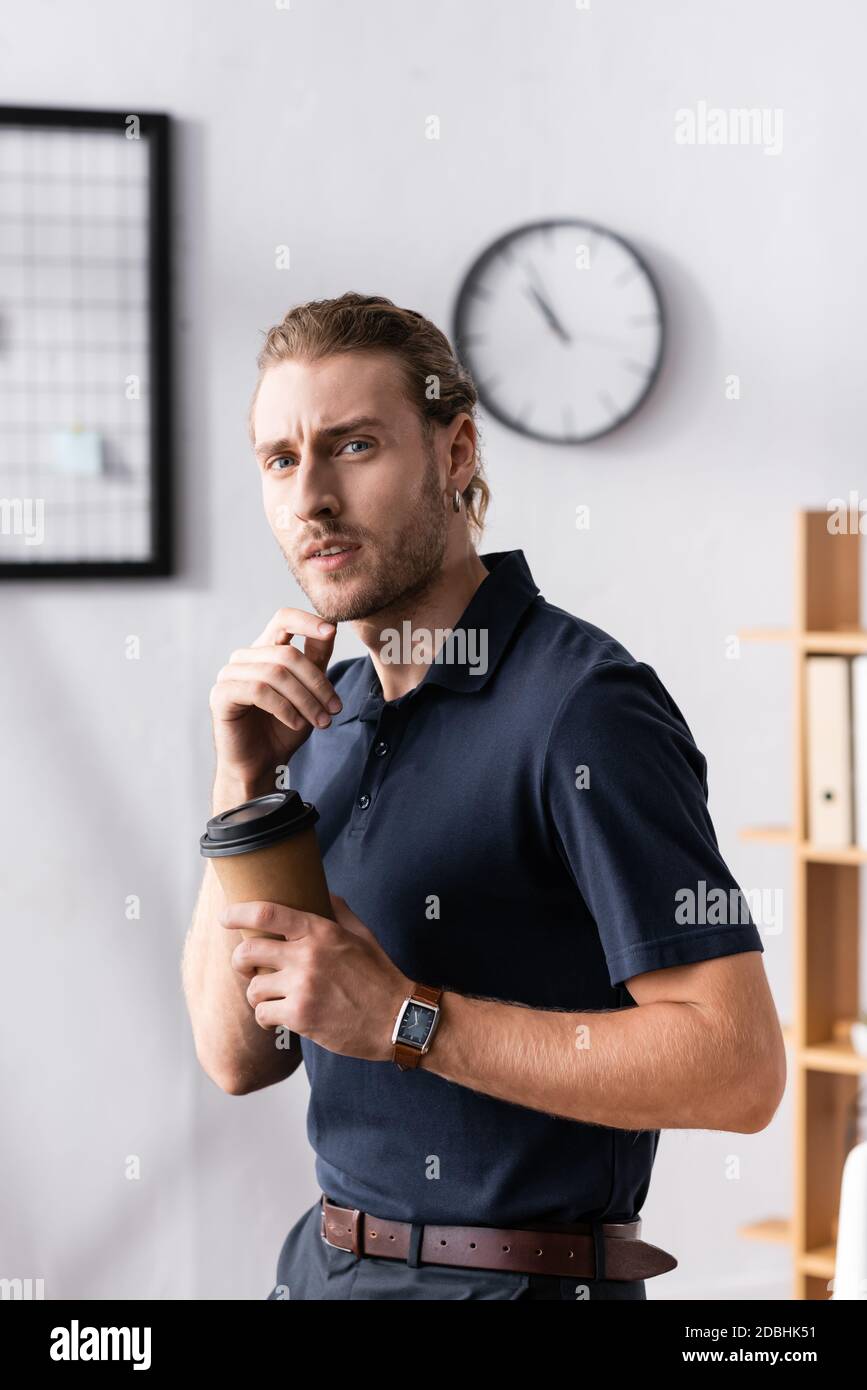 Office worker looking at clock hi-res stock photography and images - Alamy
