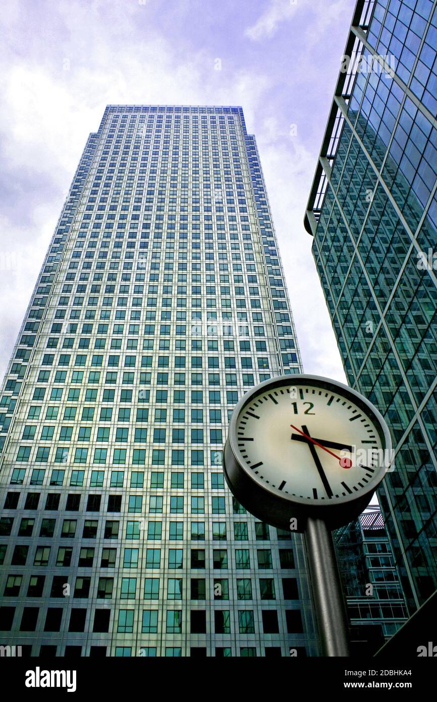 Big clock in front of two business buildings Stock Photo - Alamy