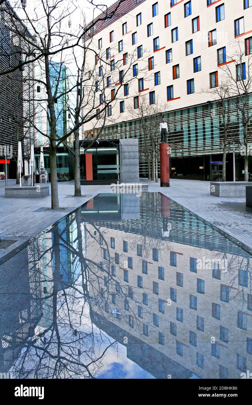 Modern building reflections on still water surface Stock Photo - Alamy