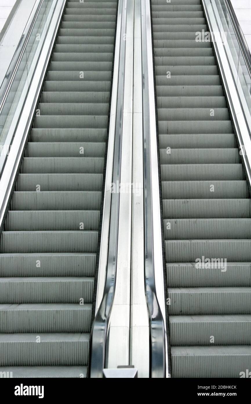 Two parallel automatic escalators close up shot Stock Photo - Alamy