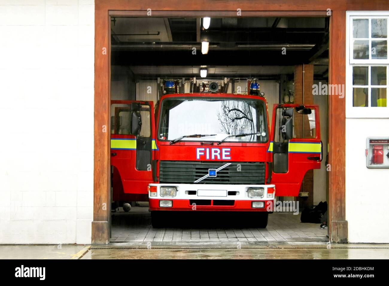 Fire engine ready for action in garage Stock Photo - Alamy
