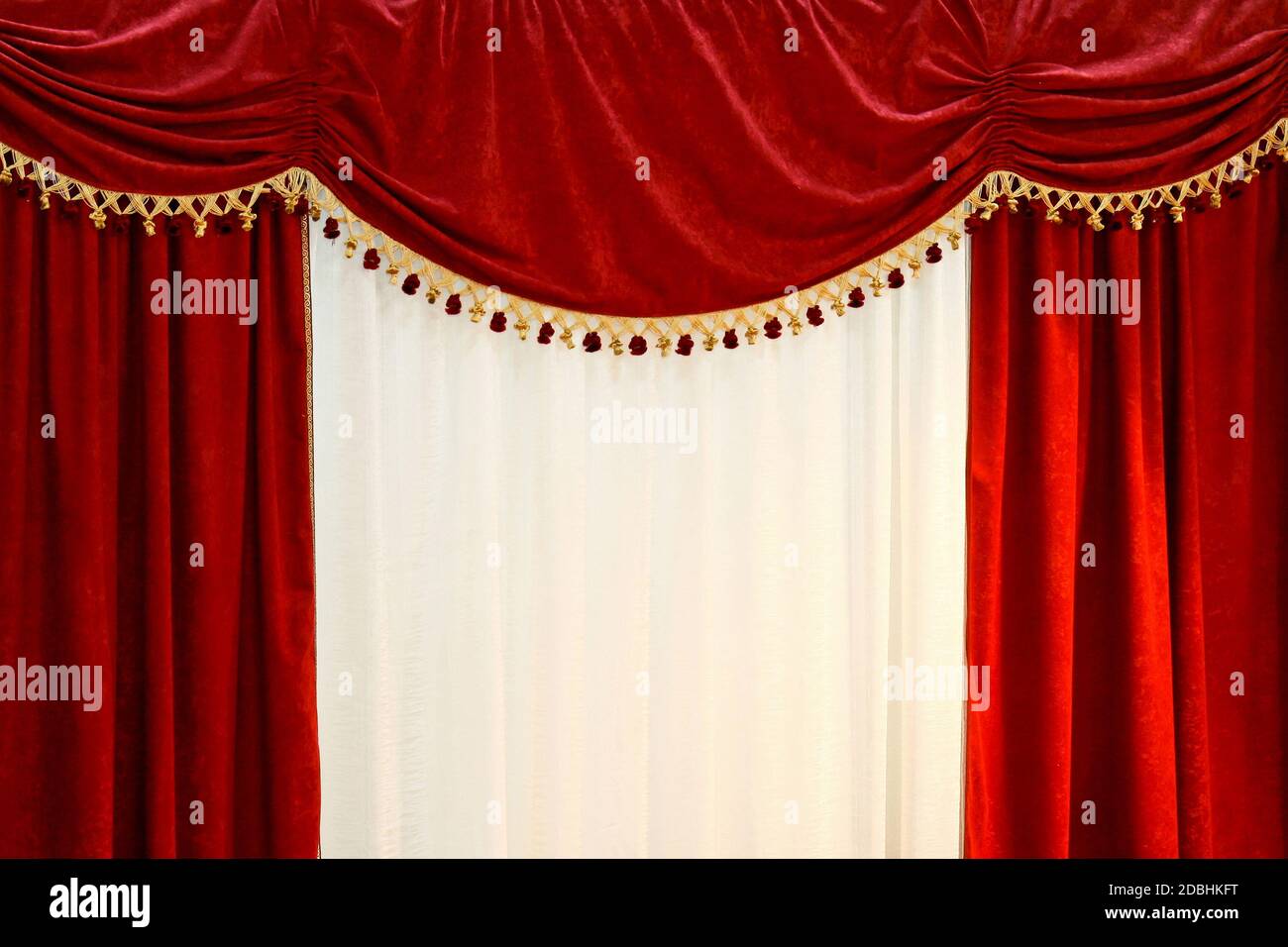 Theatre style curtains in red and white Stock Photo - Alamy
