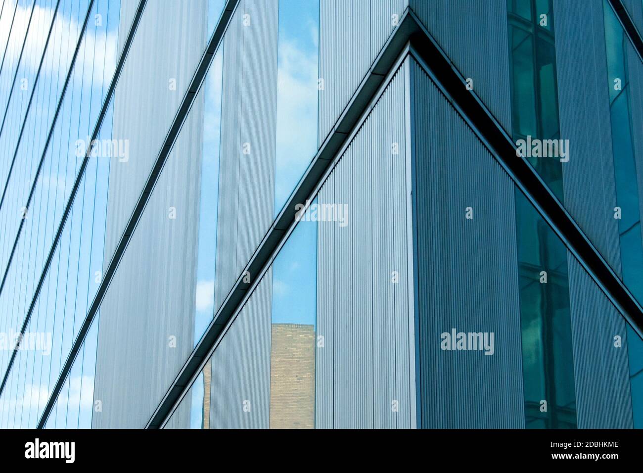 Sharp corner of geometric steel business building Stock Photo - Alamy