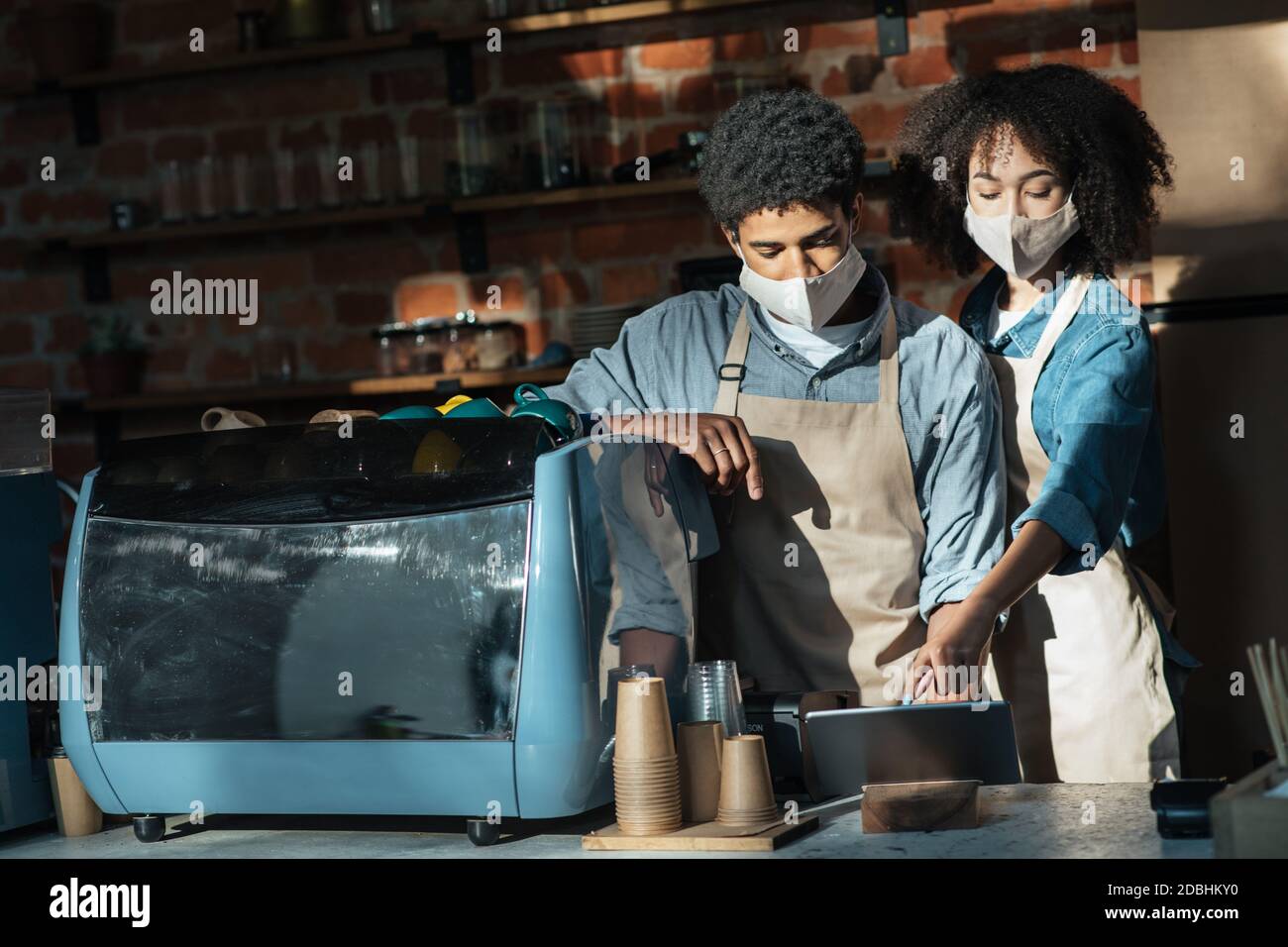 Bartender training with modern technology and equipment in cafe Stock ...