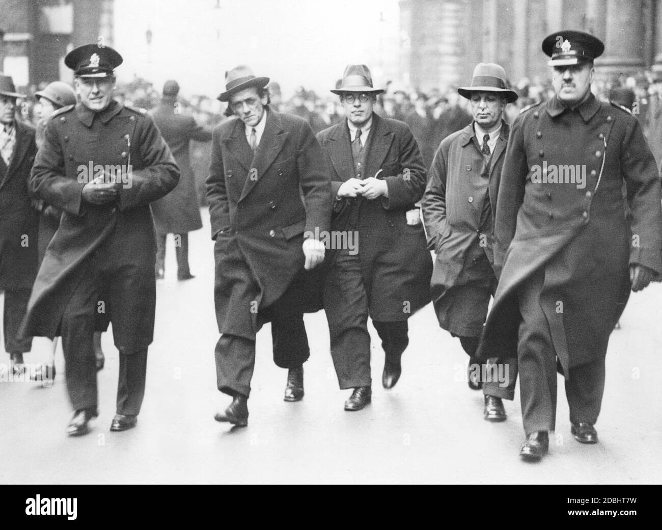 Flanked by the police, a delegation of the National Hunger March leaves ...
