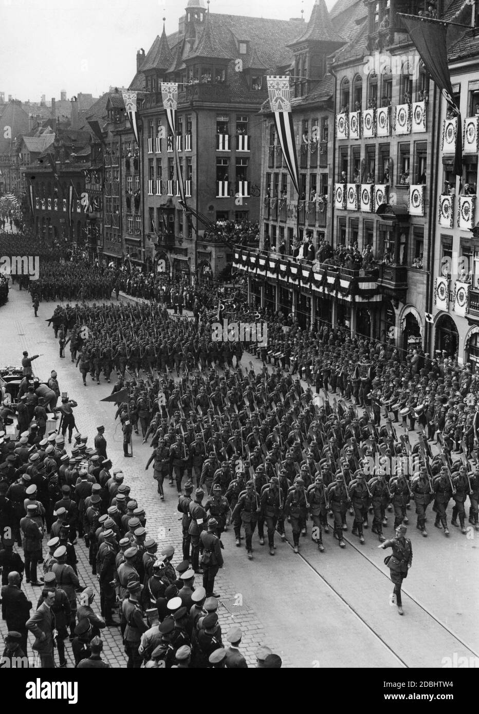 View of the formations of the RAD marching past Adolf Hitler (left in ...