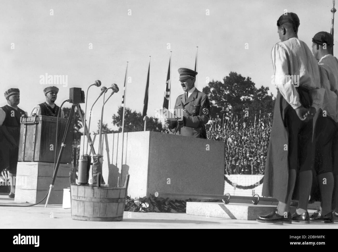 Adolf Hitler gives a speech at the groundbreaking ceremony for the new ...