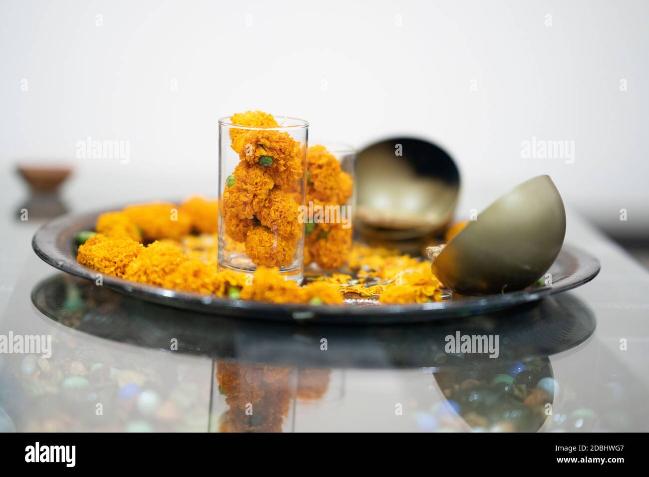 Diya with yellow flower decoration Stock Photo - Alamy