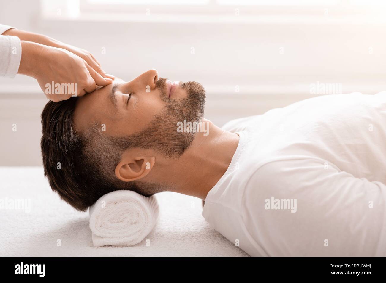 Bearded man having relaxing head massage at spa Stock Photo - Alamy