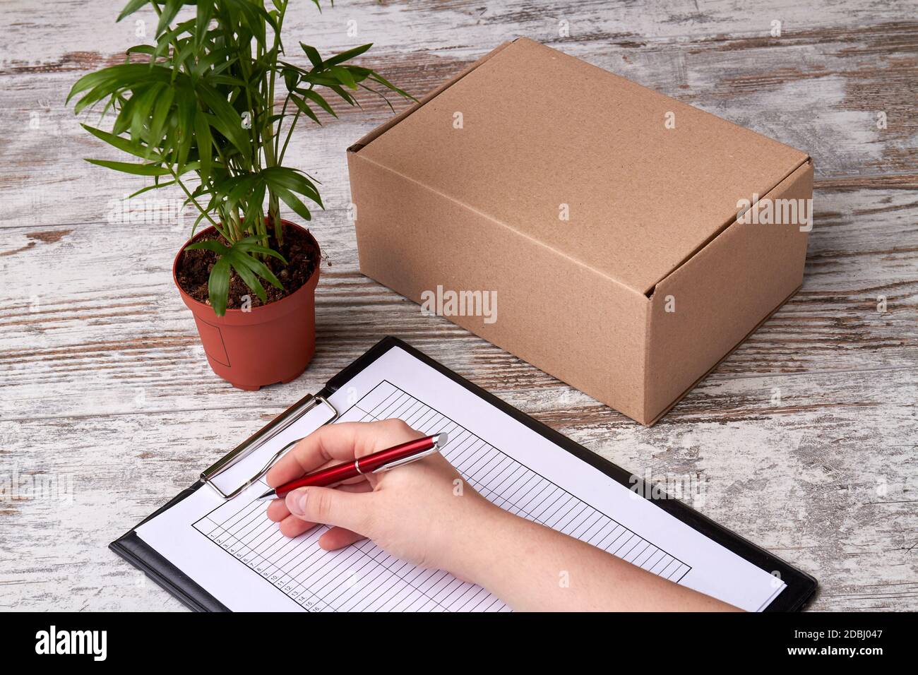 Tablet for daily planning and delivery box Stock Photo - Alamy