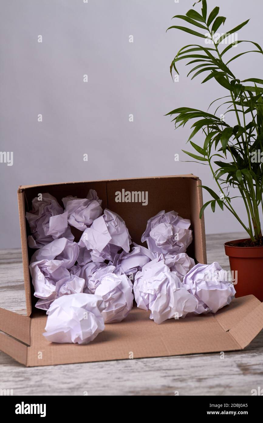 Crumpled paper balls filler in cardboard box Stock Photo - Alamy