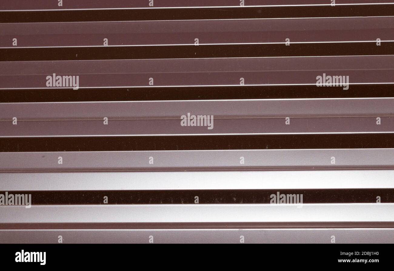 painted metal surface with uneven structure, used in metal construction ...