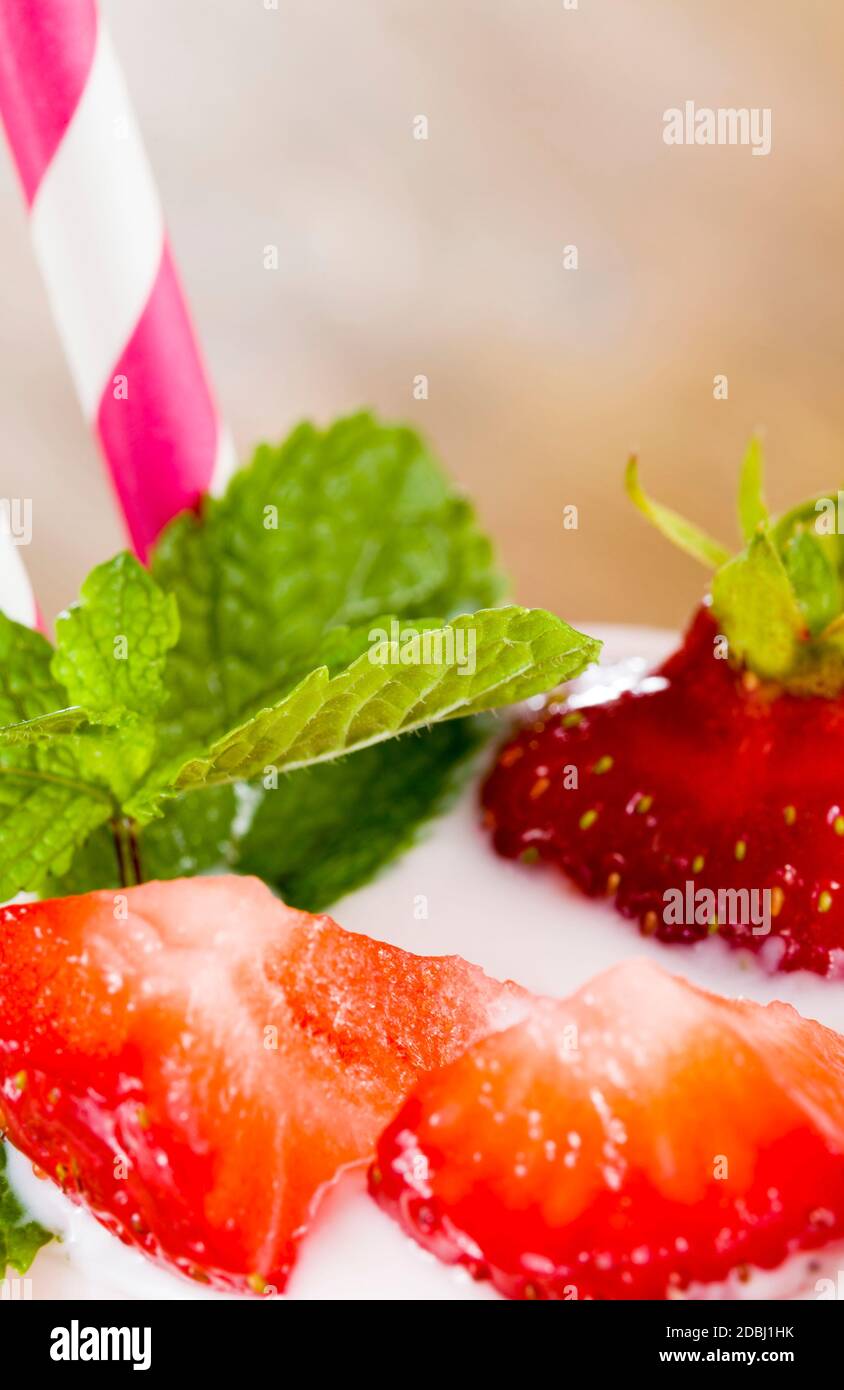 fresh and sweet strawberries in yogurt, close-up while making homemade ...