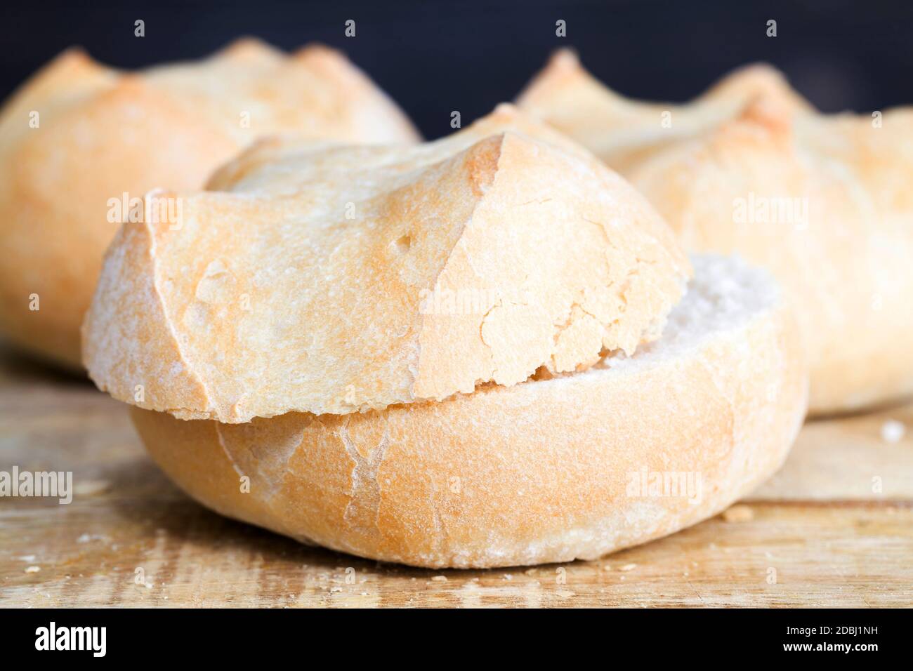 sliced fresh round white buns, close-up of cereal food for making ...