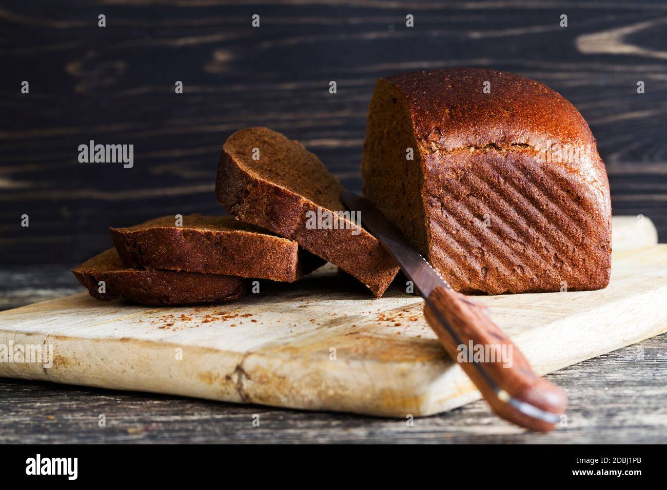 black made from rye flour square loaf of bread, sliced Stock Photo - Alamy