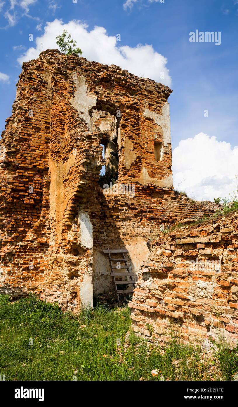 dilapidated with potholes old brick tower of the fortress of the ...