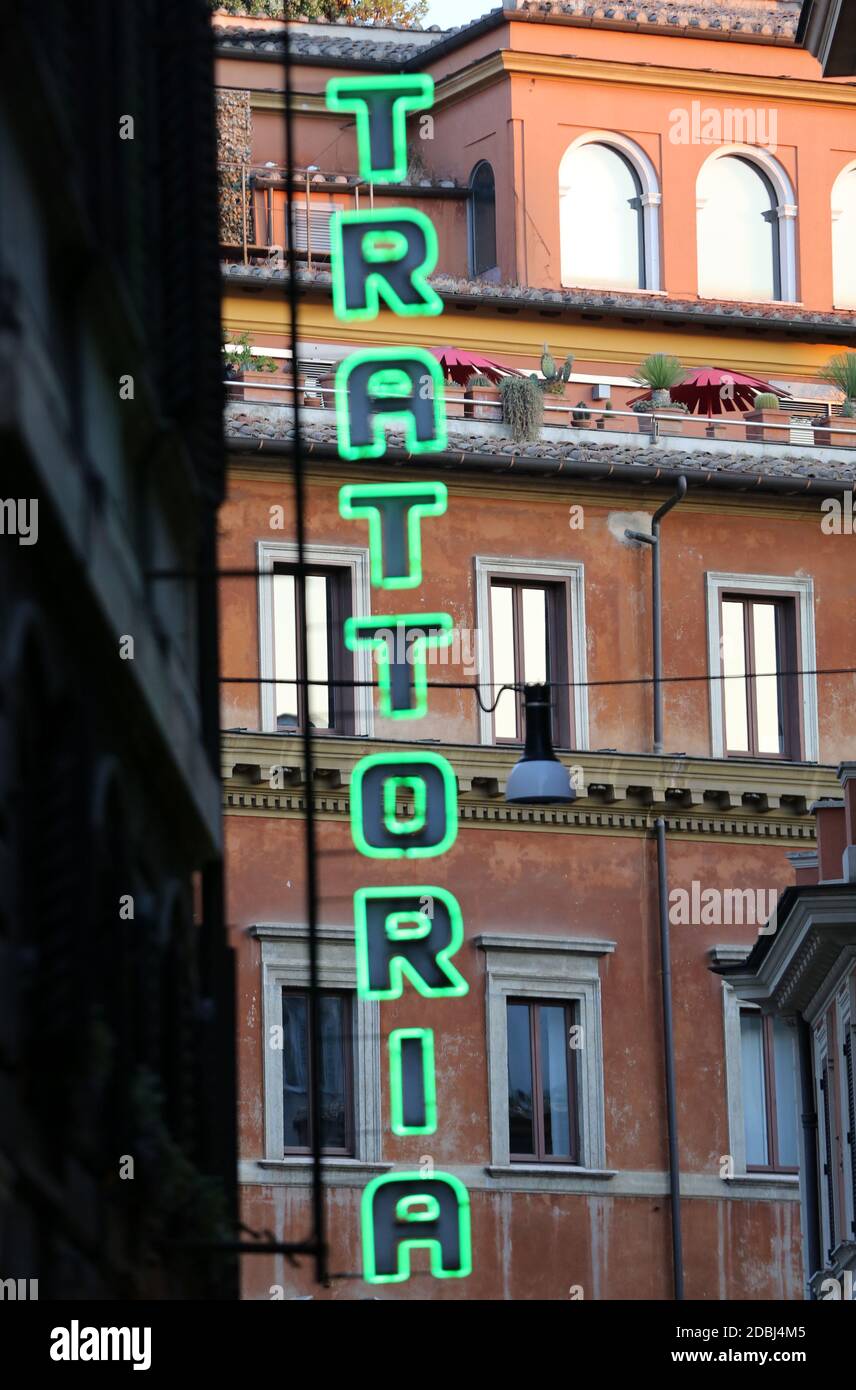 Trattoria neon sign in Rome street Stock Photo - Alamy