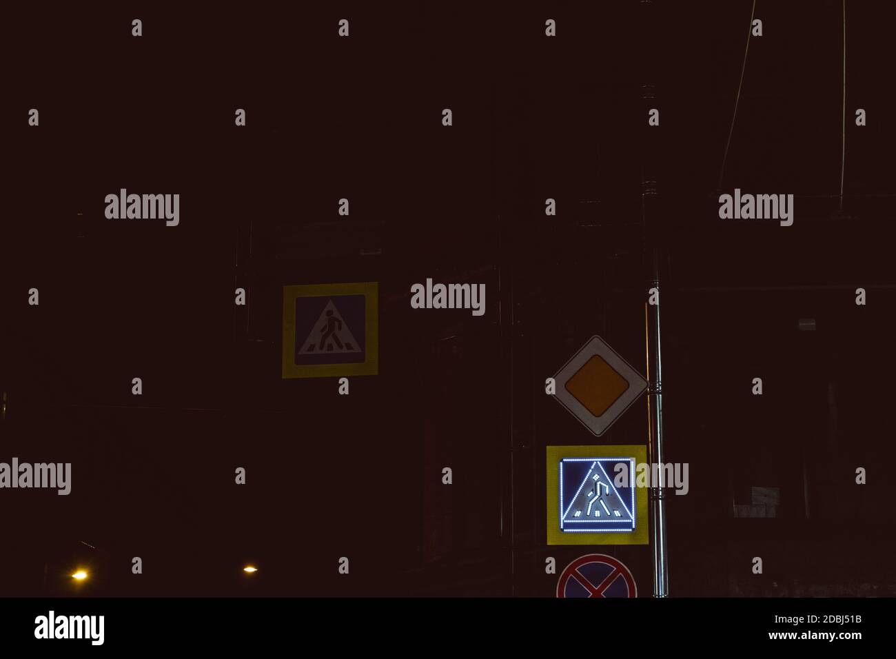 pedestrian crossing sign glowing in the dark city street night Stock ...