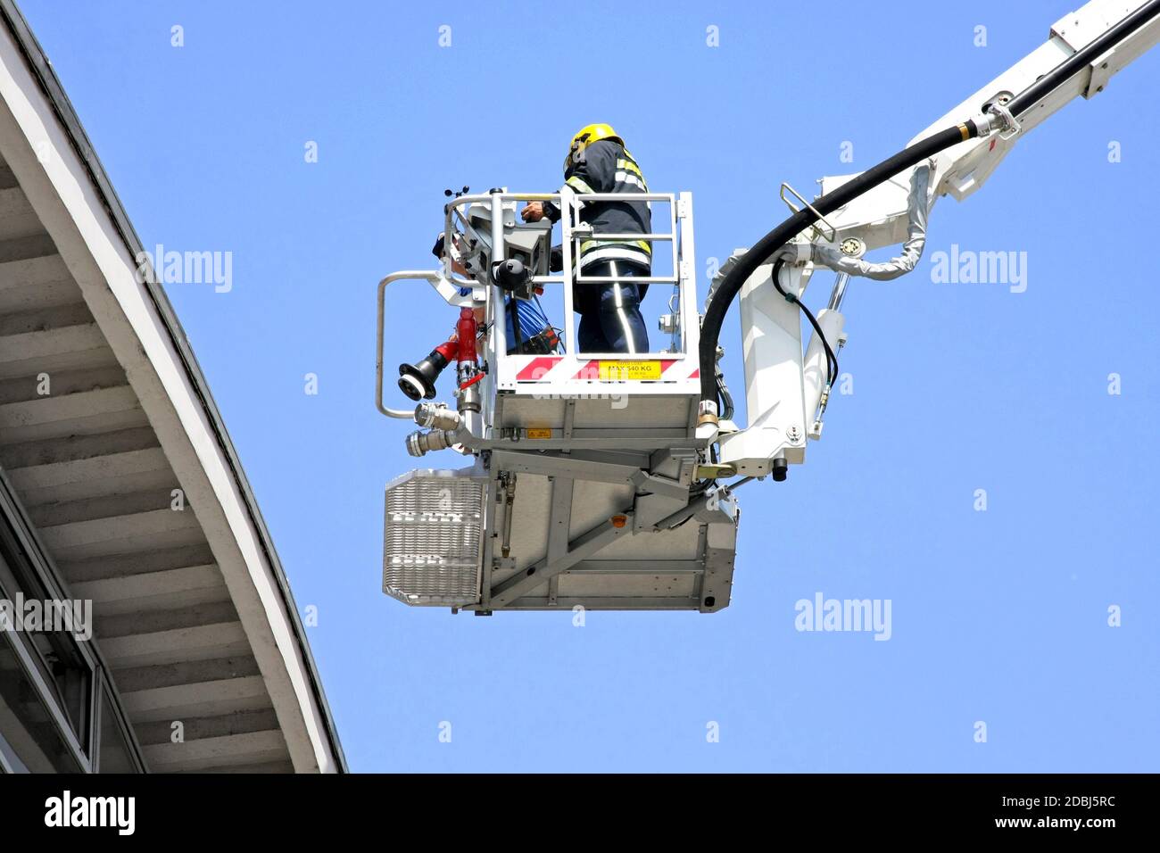 Fire fighter in big and tall crane Stock Photo - Alamy