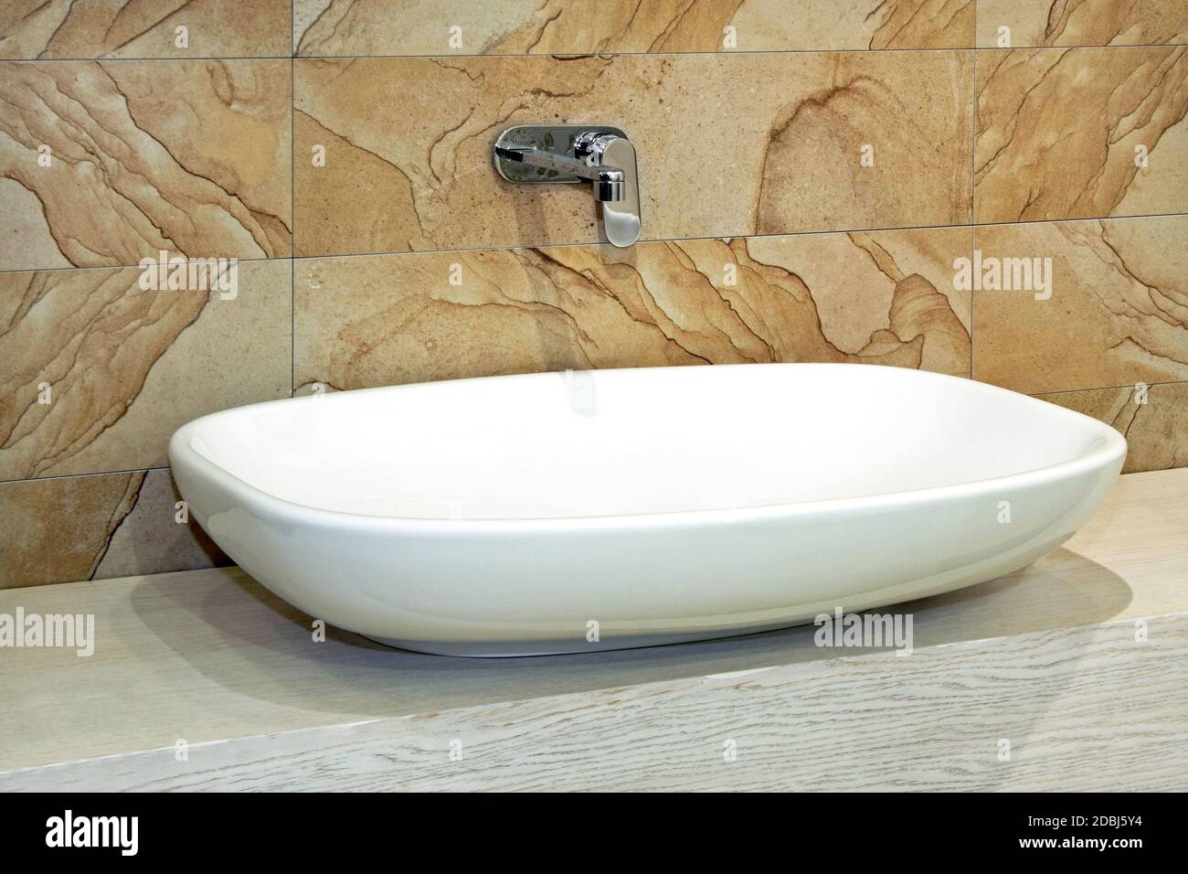 White and wide basin and marble wall Stock Photo - Alamy