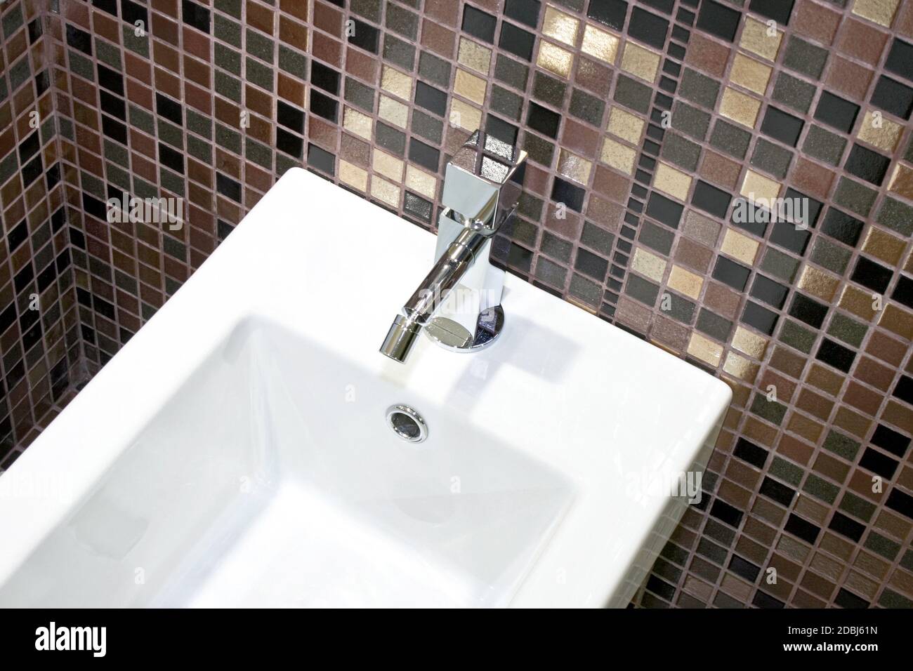 Square shape of geometric basin and brown tiles Stock Photo - Alamy