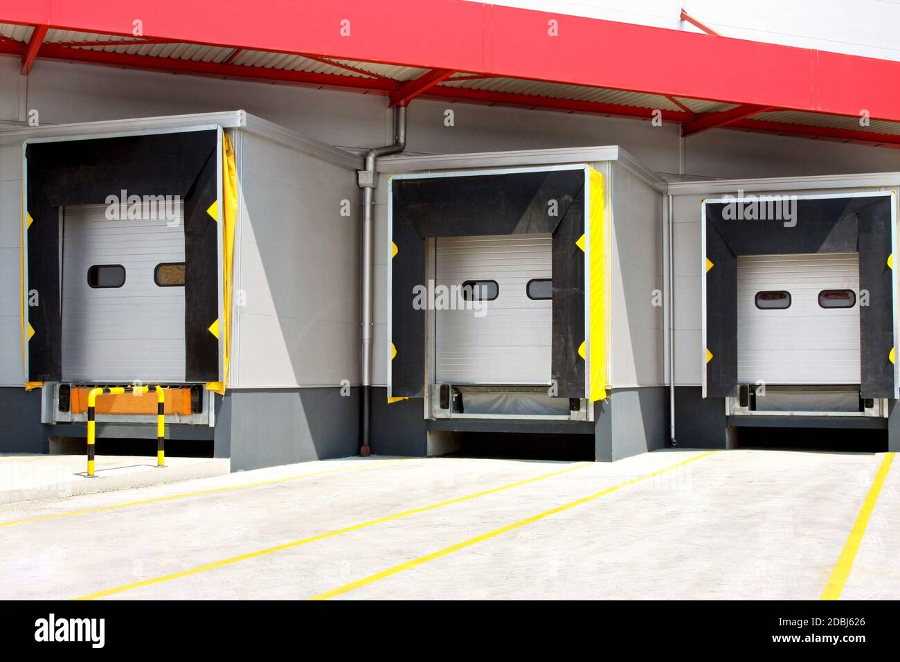 Loading warehouse deck with big cargo doors Stock Photo - Alamy