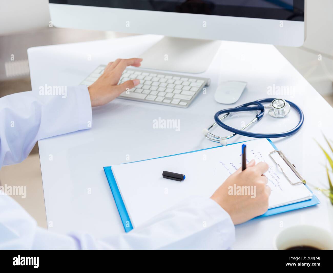 Medicine doctor's working on desk. Closeup of Stethoscope. Hand of ...