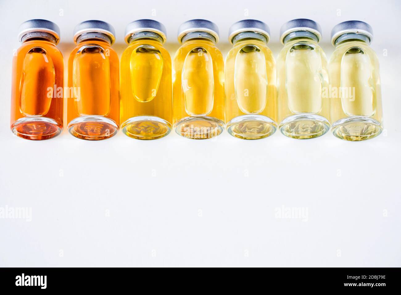 New vaccine liquid in ampules, different color variations of vaccine on ...