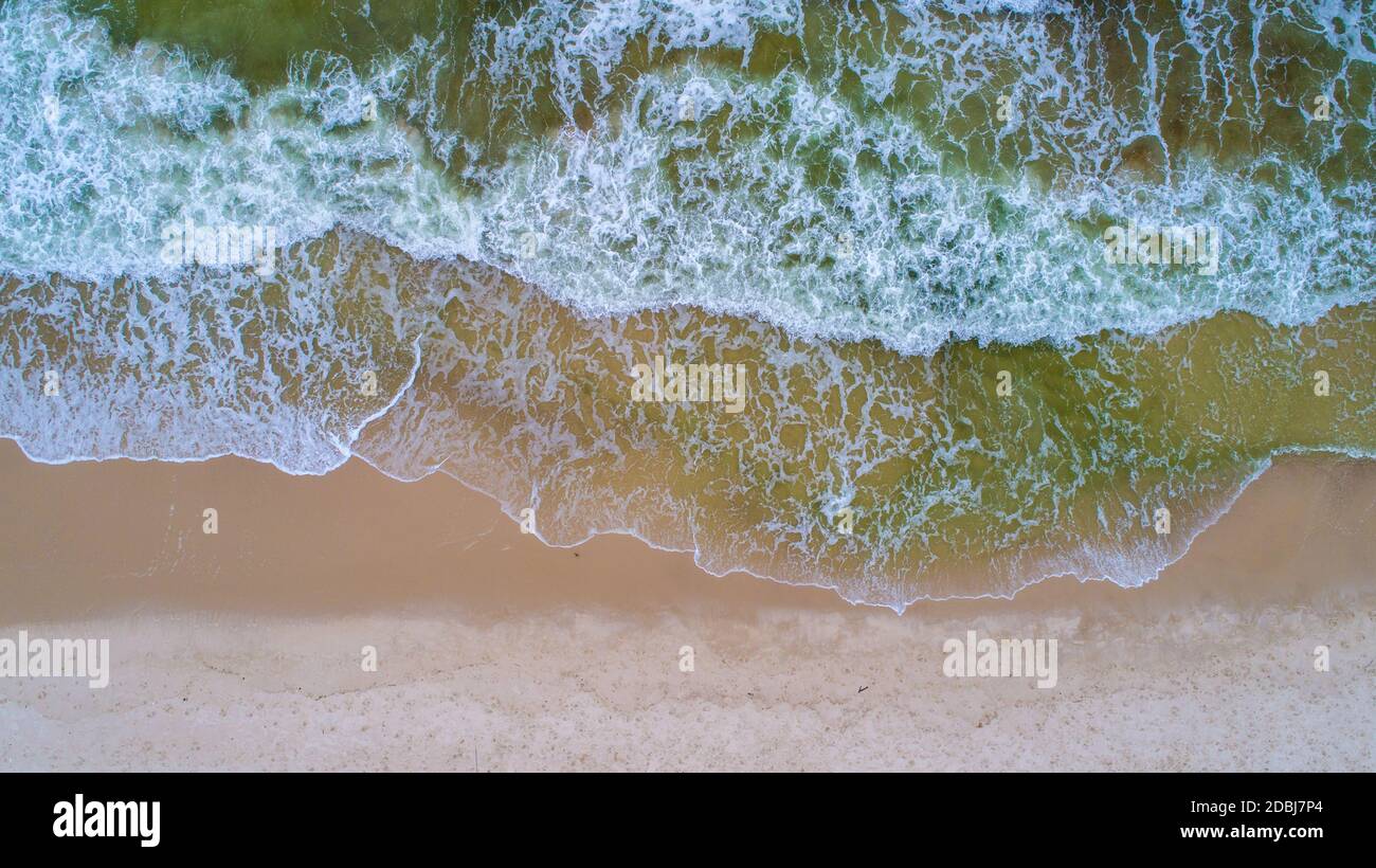 Aerial view of the waves on the shoreline of the beach in Perdido Key ...