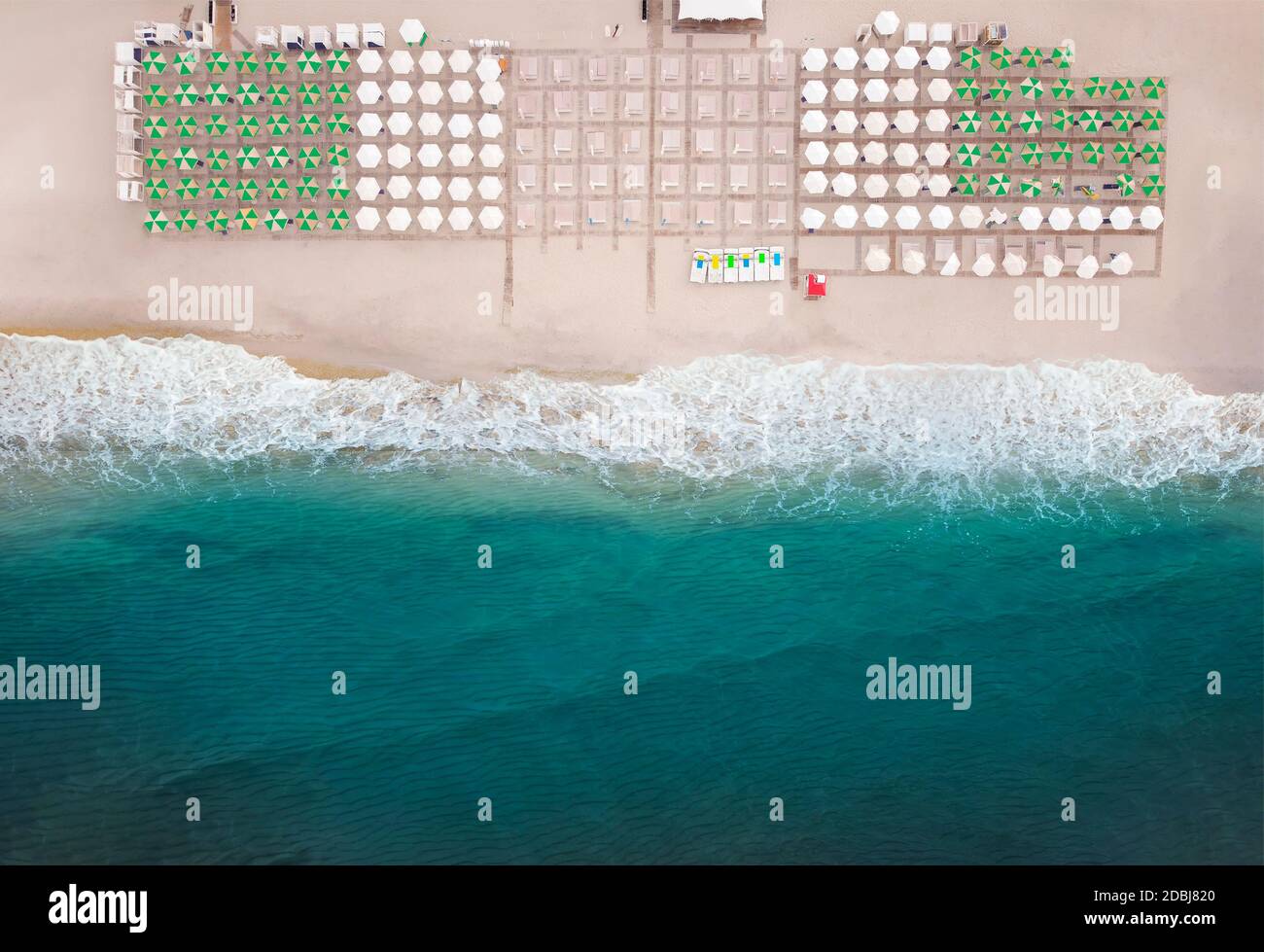 Aerial view of amazing beach with umbrellas and turquoise sea in summer ...